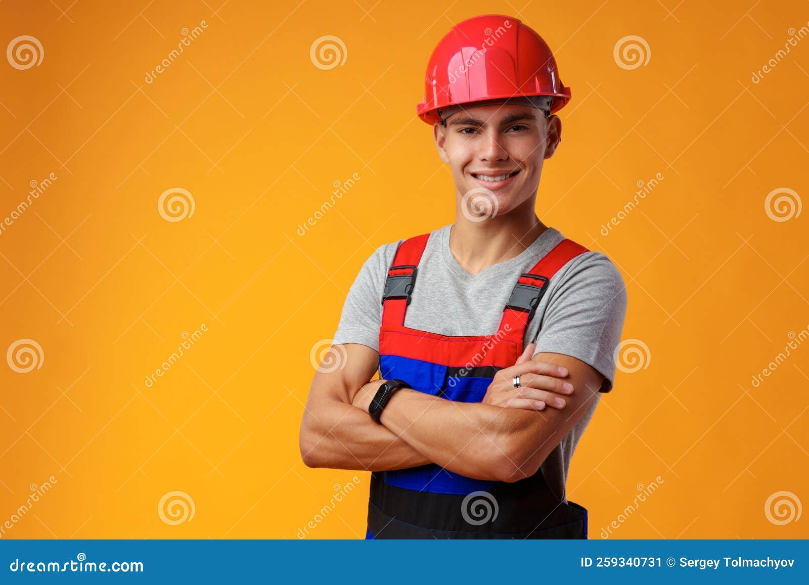Young Construction Worker in Helmet and Uniform Posing on Yellow ...