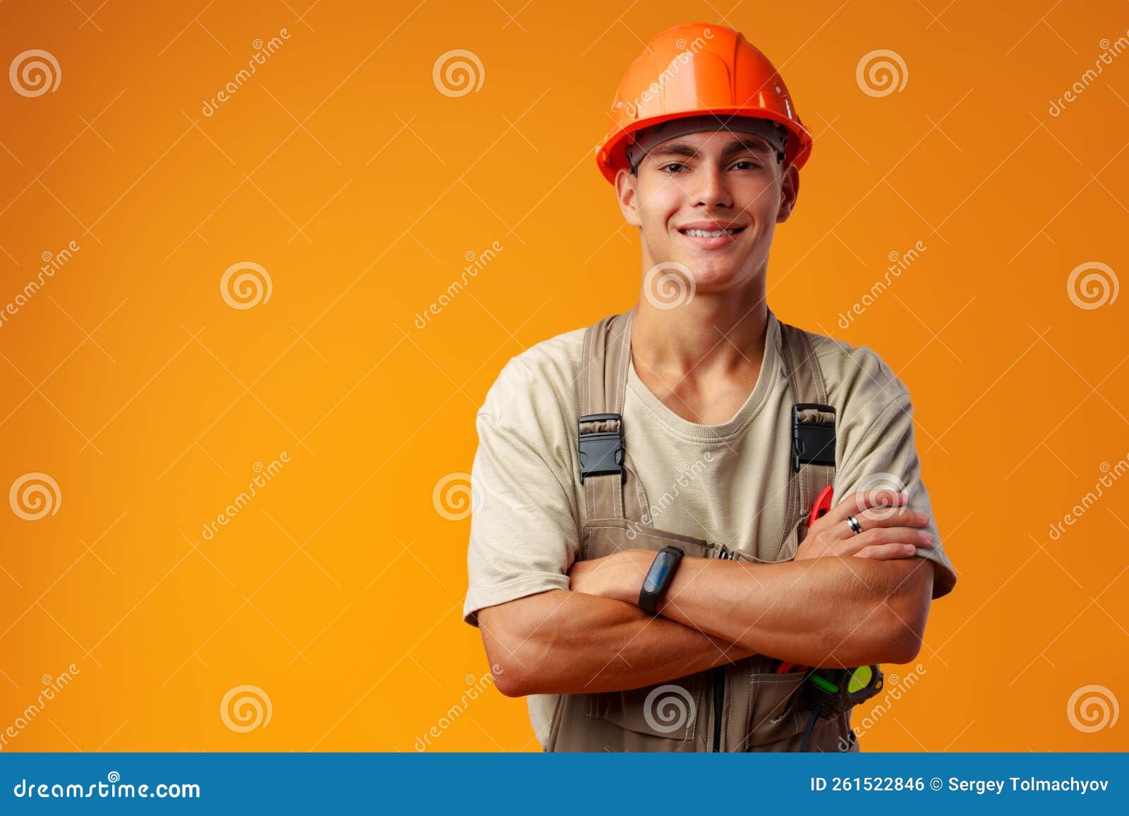 Young Construction Worker in Helmet and Uniform Posing on Yellow ...