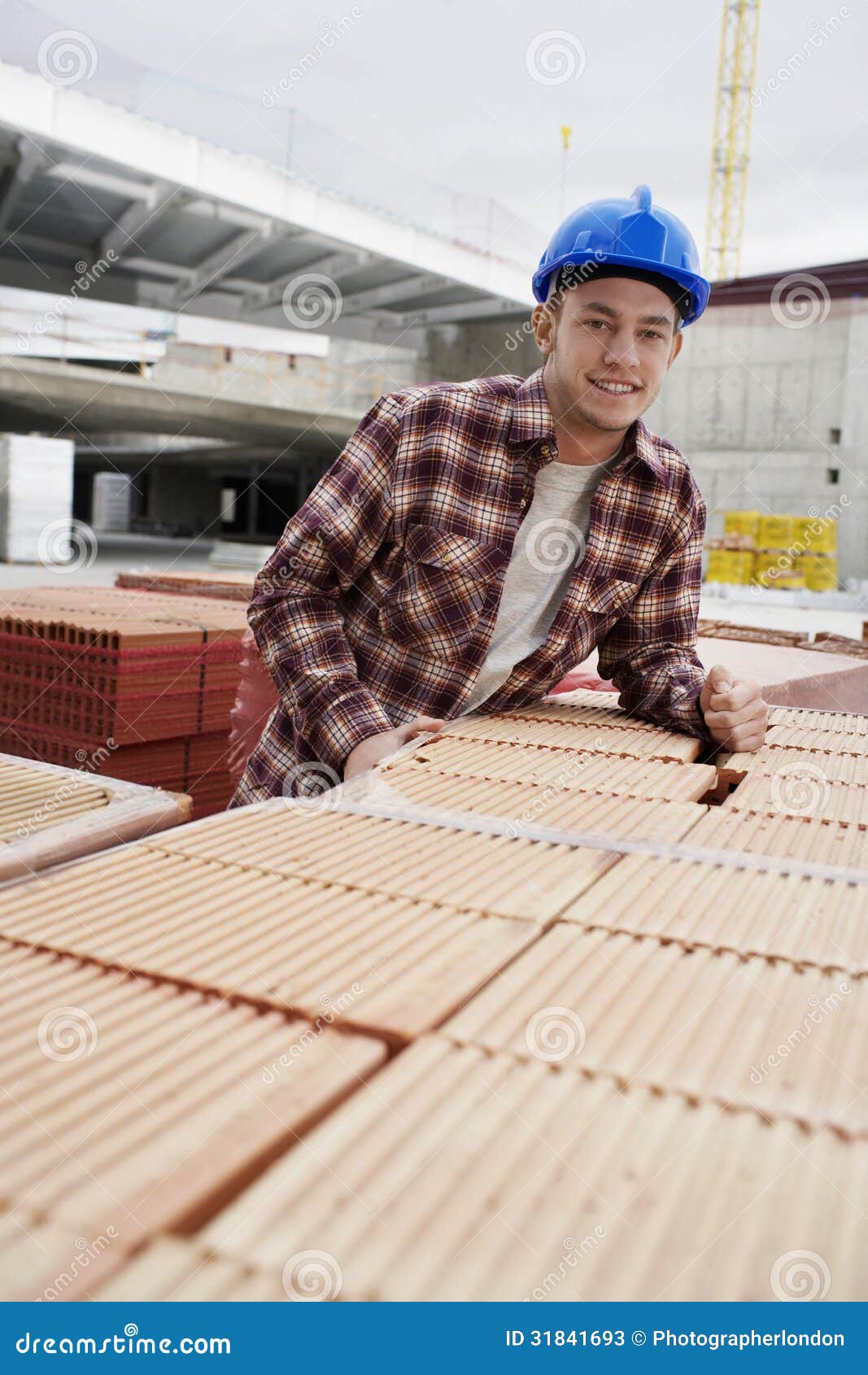 Young Construction Worker Leaning on Tiles Stock Image - Image of ...