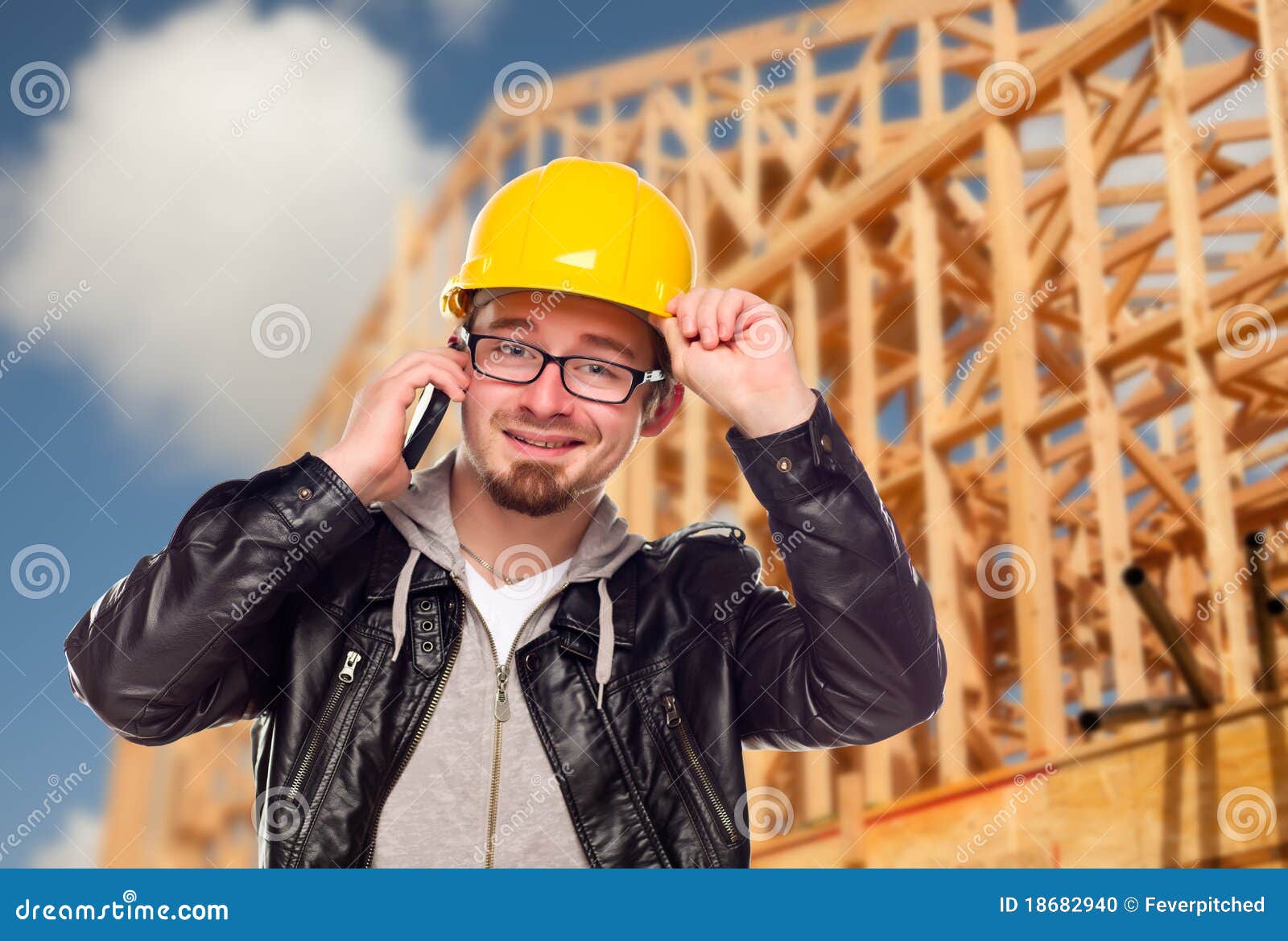 Young Construction Worker on Phone at House Site Stock Photo - Image of ...