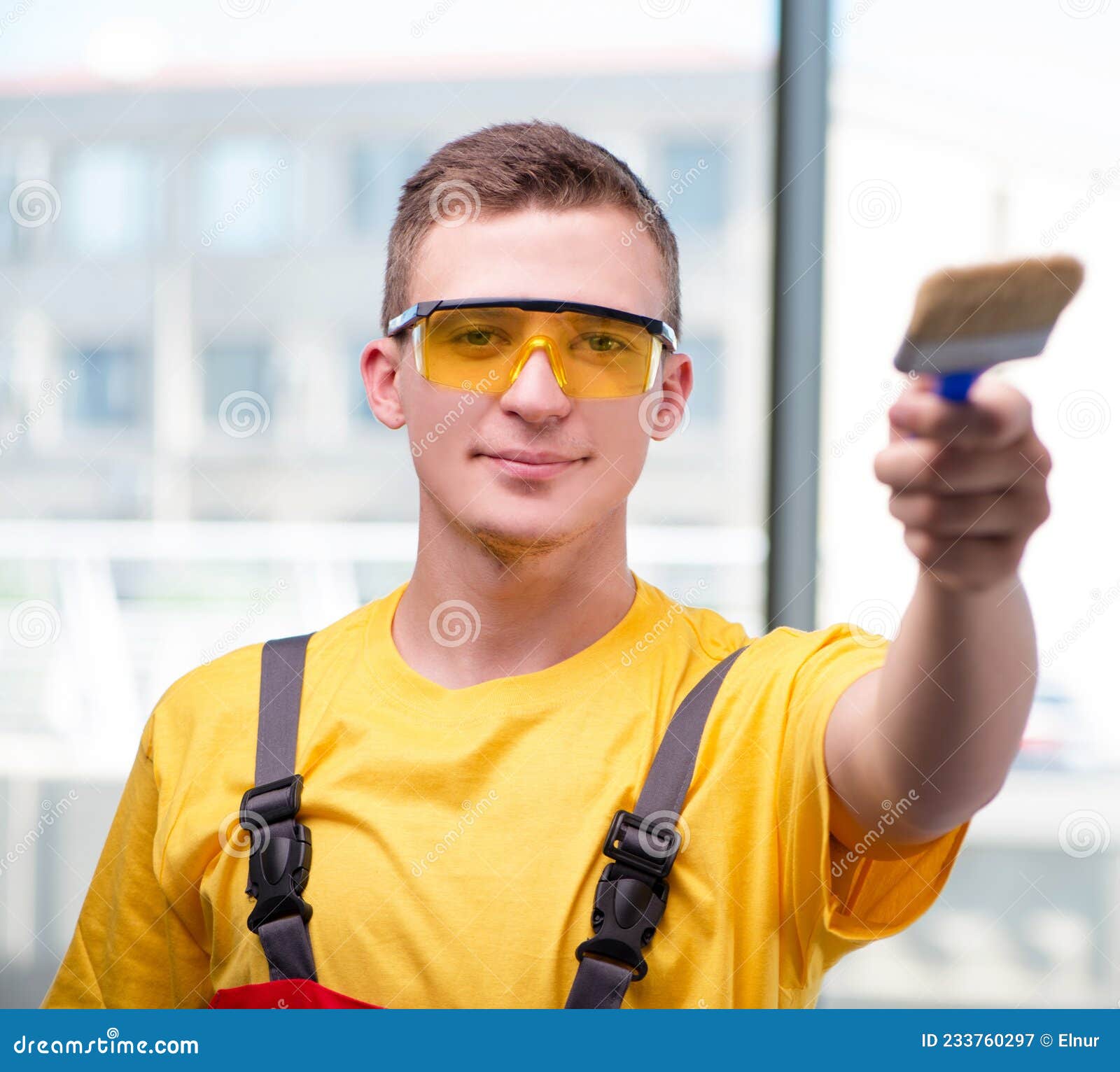 Young Construction Worker in Yellow Coveralls Stock Image - Image of ...