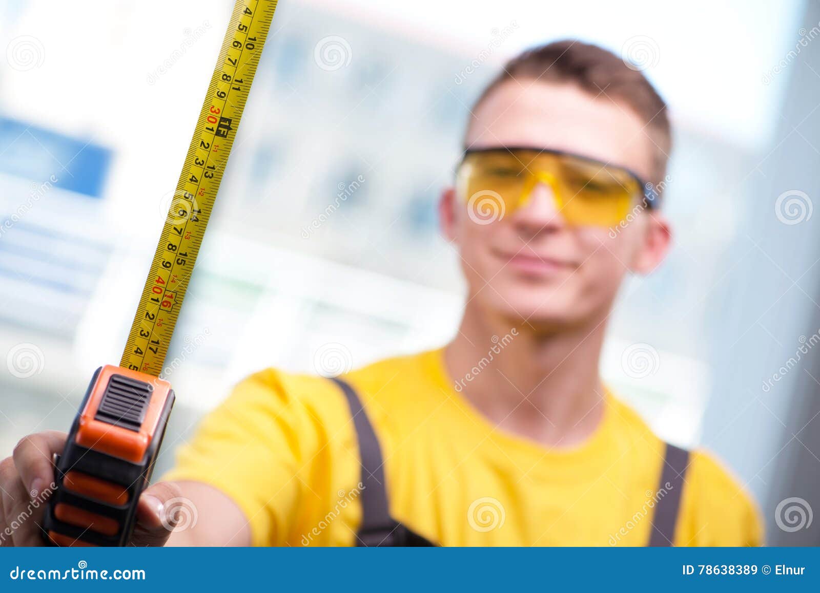 The Young Construction Worker in Yellow Coveralls Stock Image - Image ...