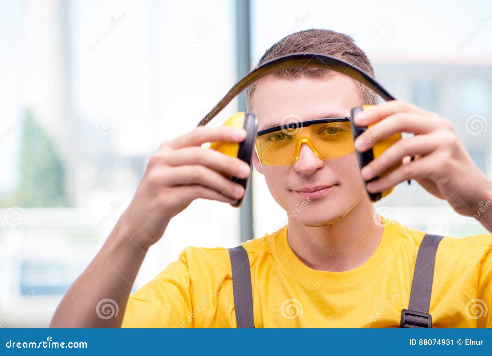 The Young Construction Worker in Yellow Coveralls Stock Image - Image ...