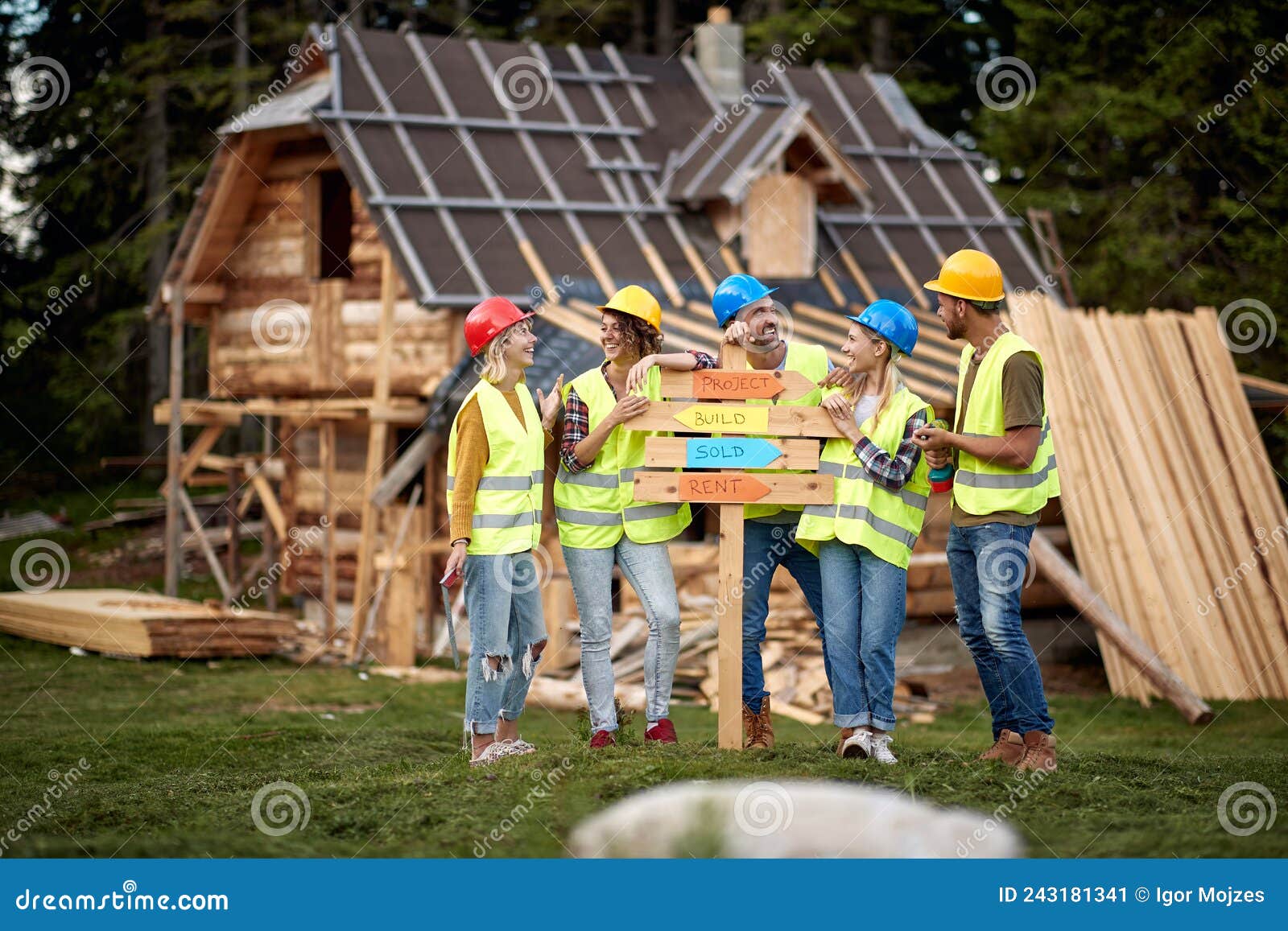 Young Construction Workers.Teamwork.Building. Woodworking Team Work ...