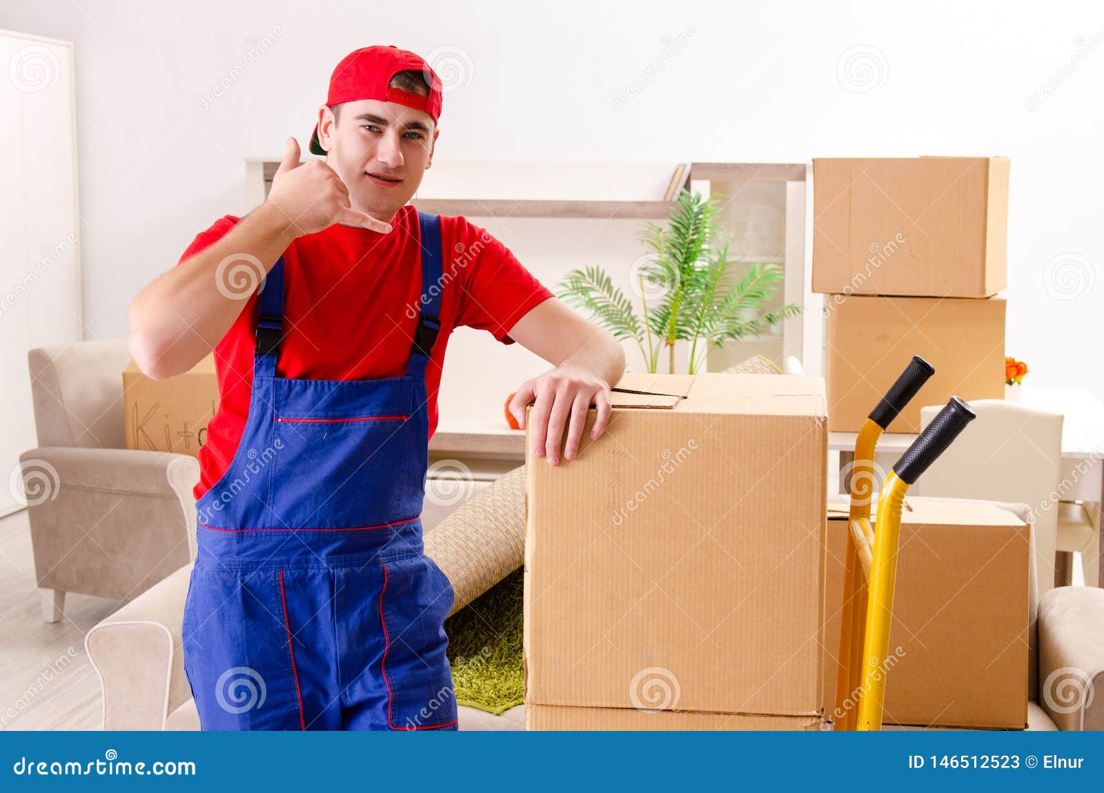The Young Contractor with Boxes Working Indoors Stock Image - Image of ...