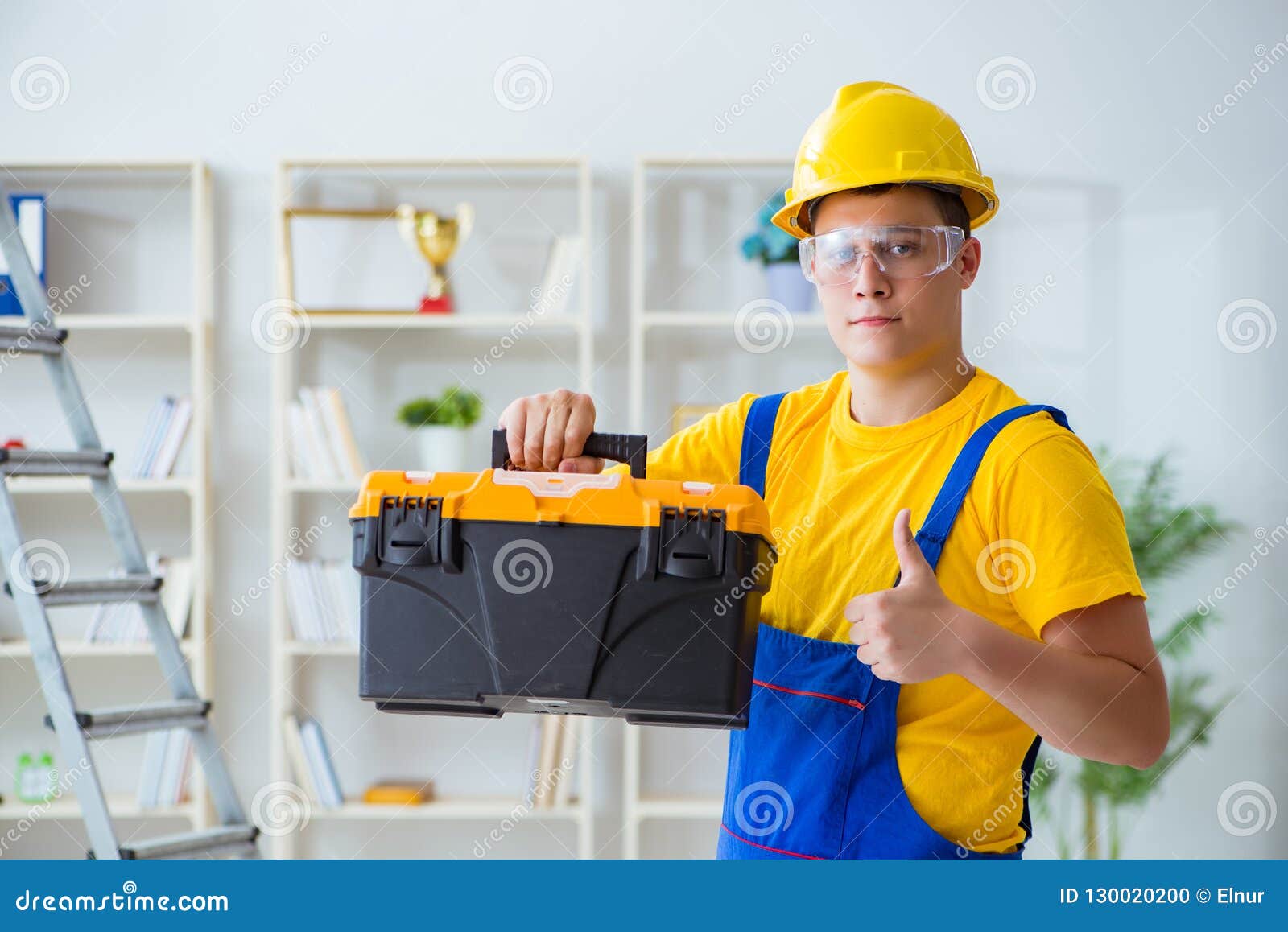The Young Contractor Doing Repair Works at Office Stock Photo - Image ...