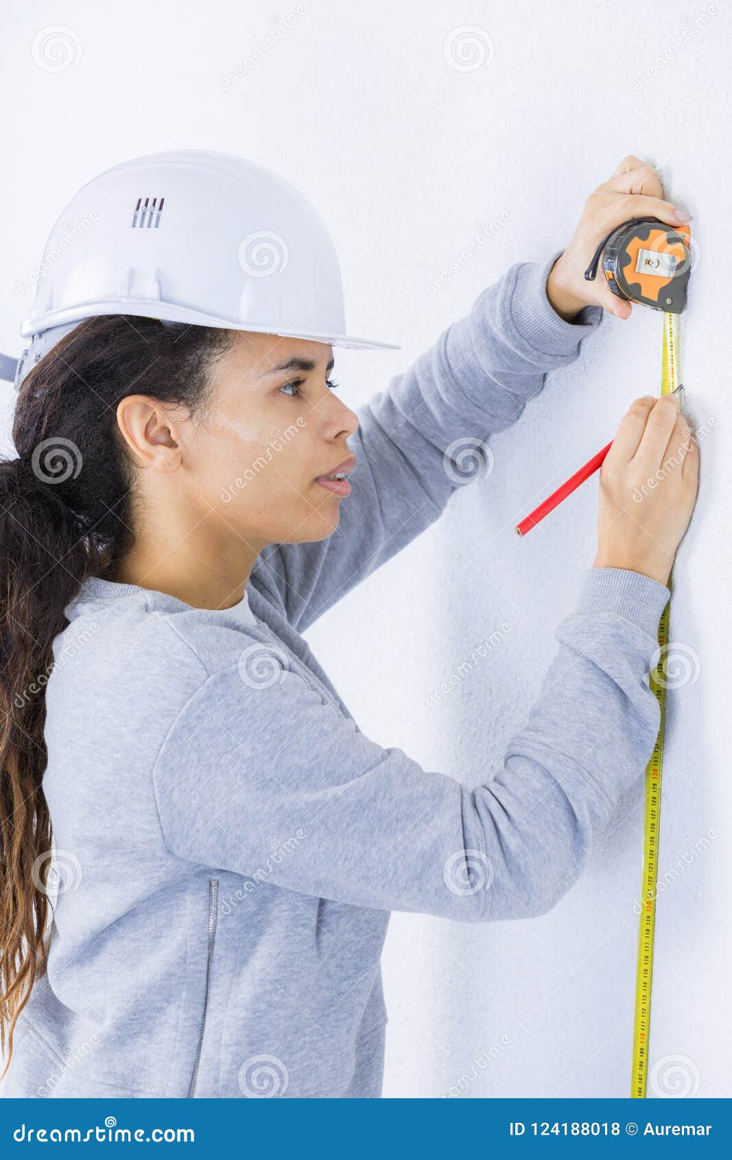 Young Contractor Measuring and Marking Wall Stock Photo - Image of ...