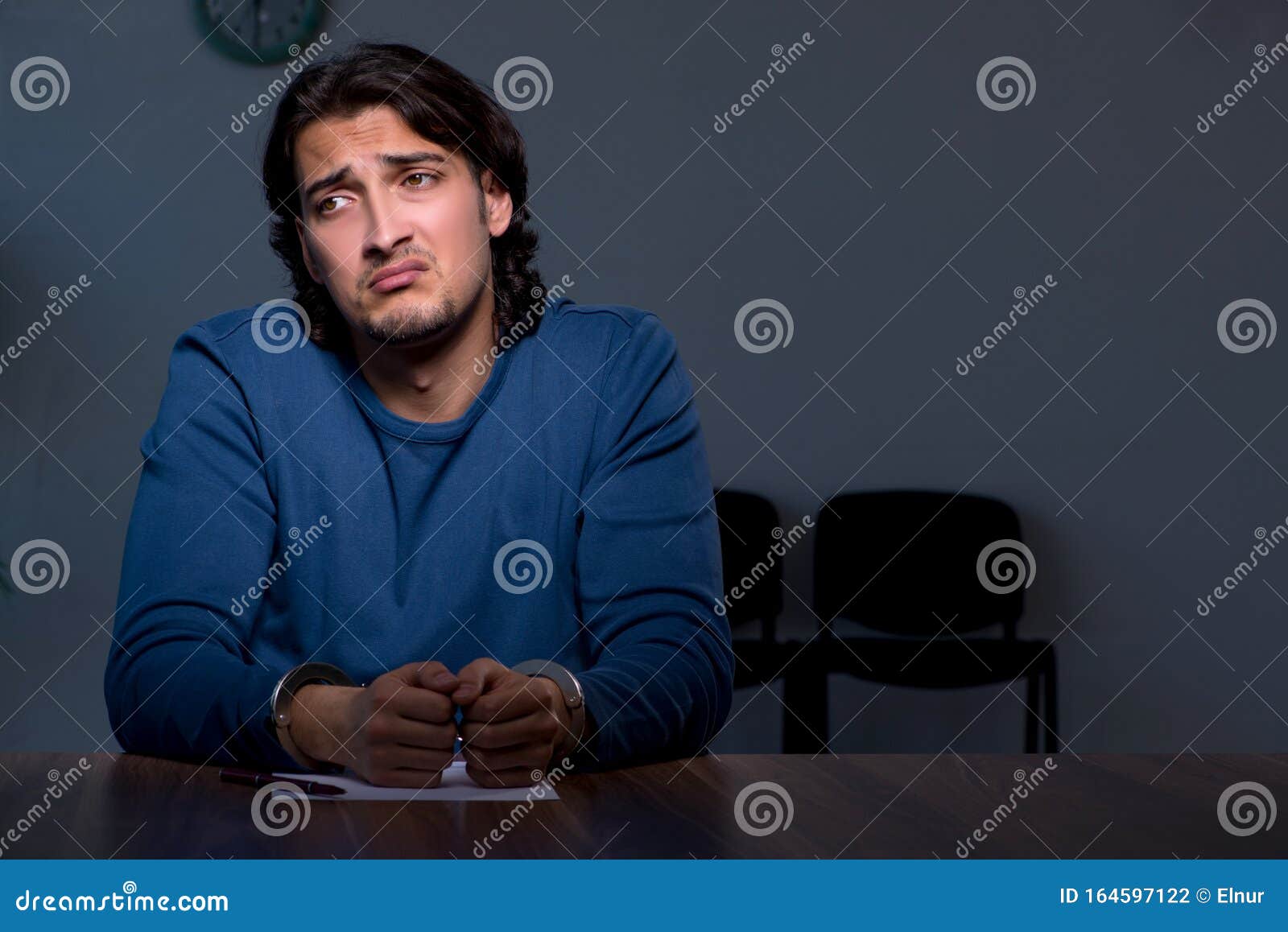Young Convict Man Sitting in Dark Room Stock Photo - Image of dark ...