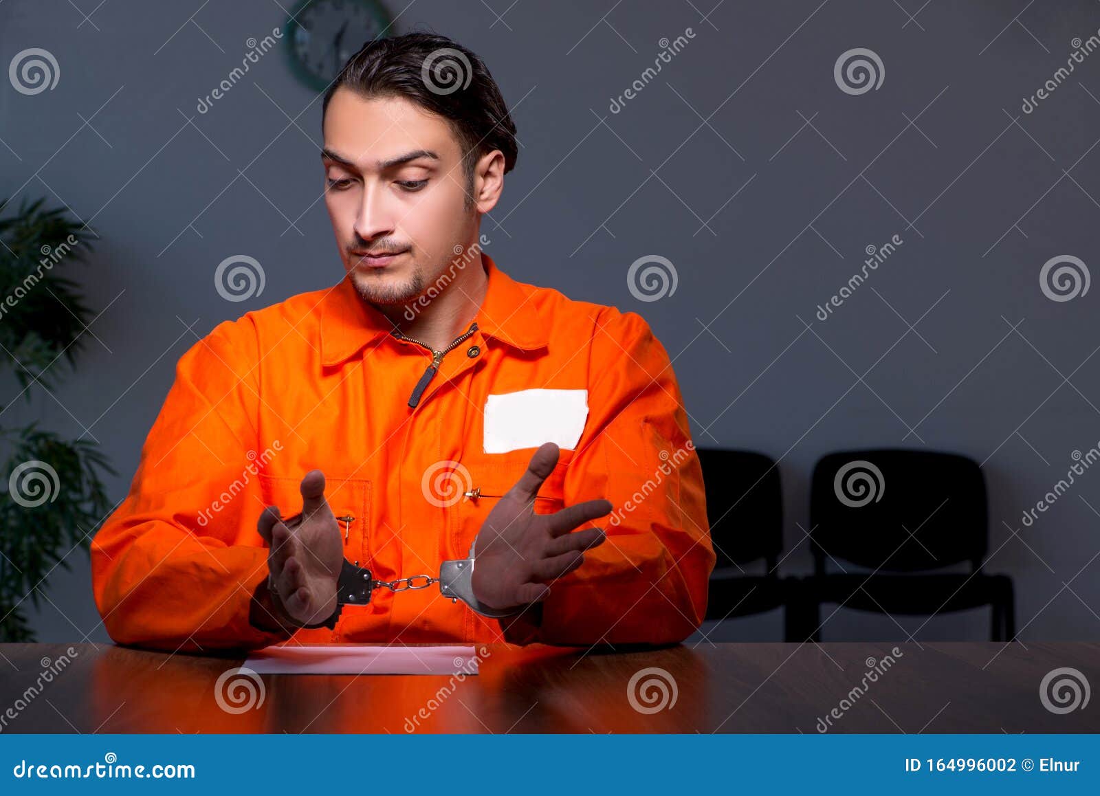 Young Convict Man Sitting in Dark Room Stock Photo - Image of ...
