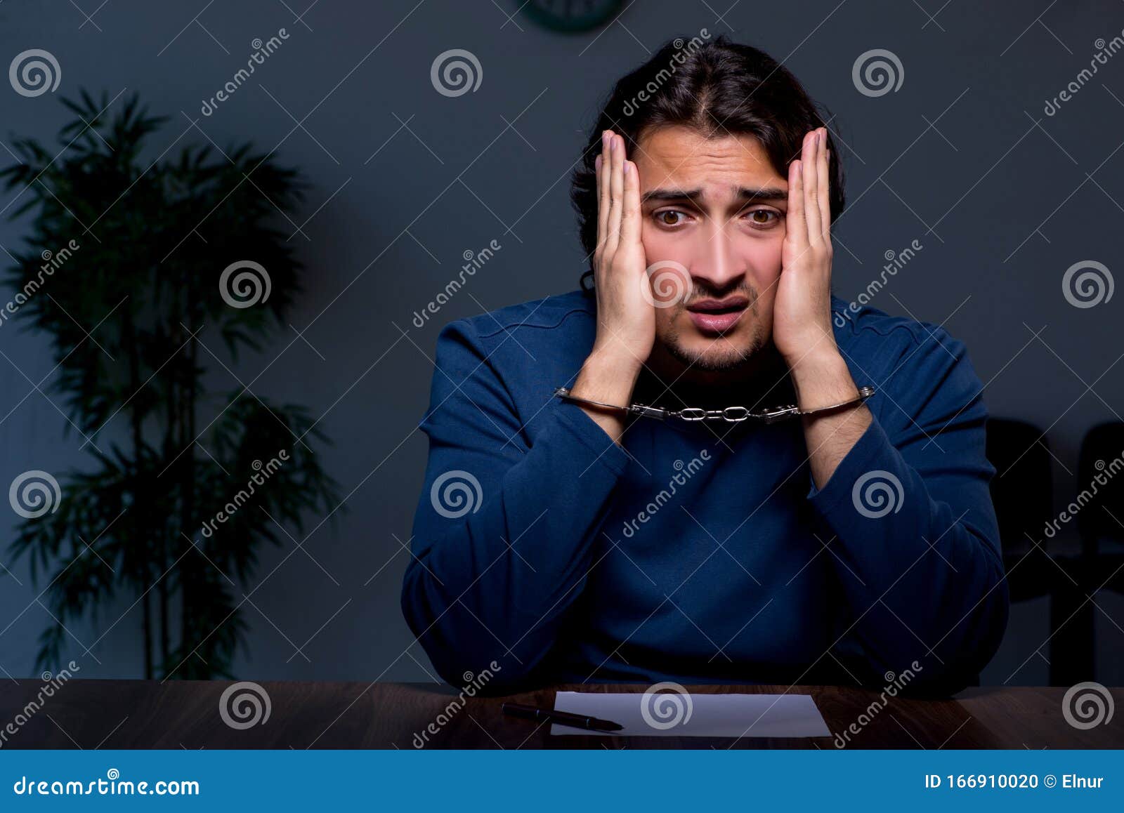 Young Convict Man Sitting in Dark Room Stock Photo - Image of gangster ...