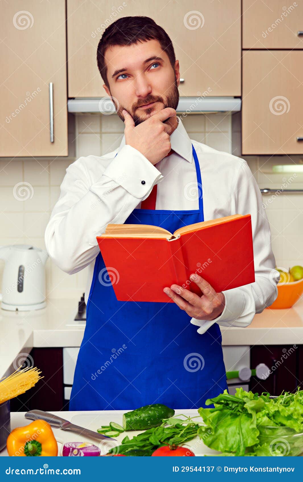Young Cook with Cookbook Thinking about Recipe Stock Image - Image of ...
