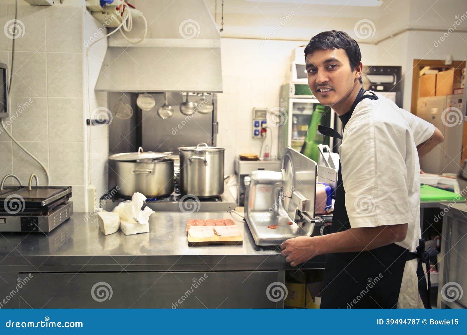 Young cook in a kitchen stock image. Image of worker - 39494787