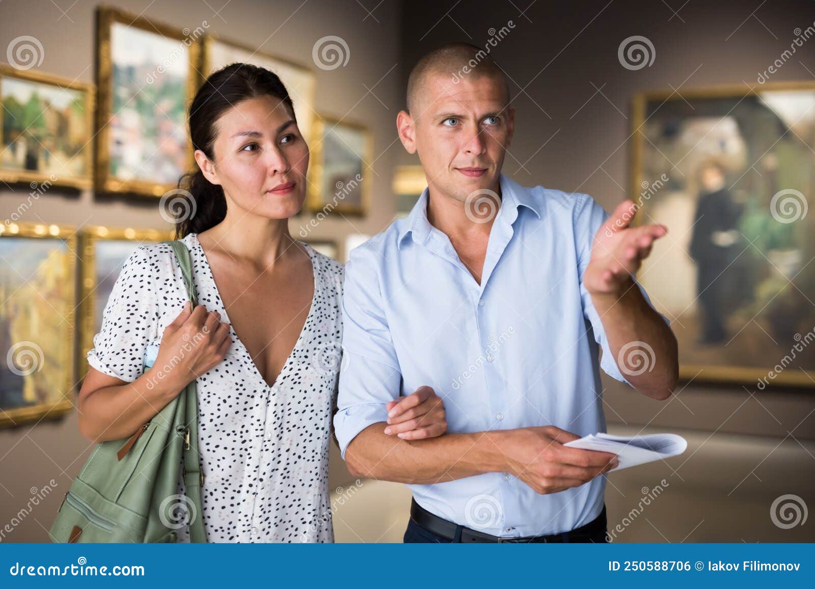 Couple admiring art work stock photo. Image of filipino - 250588706
