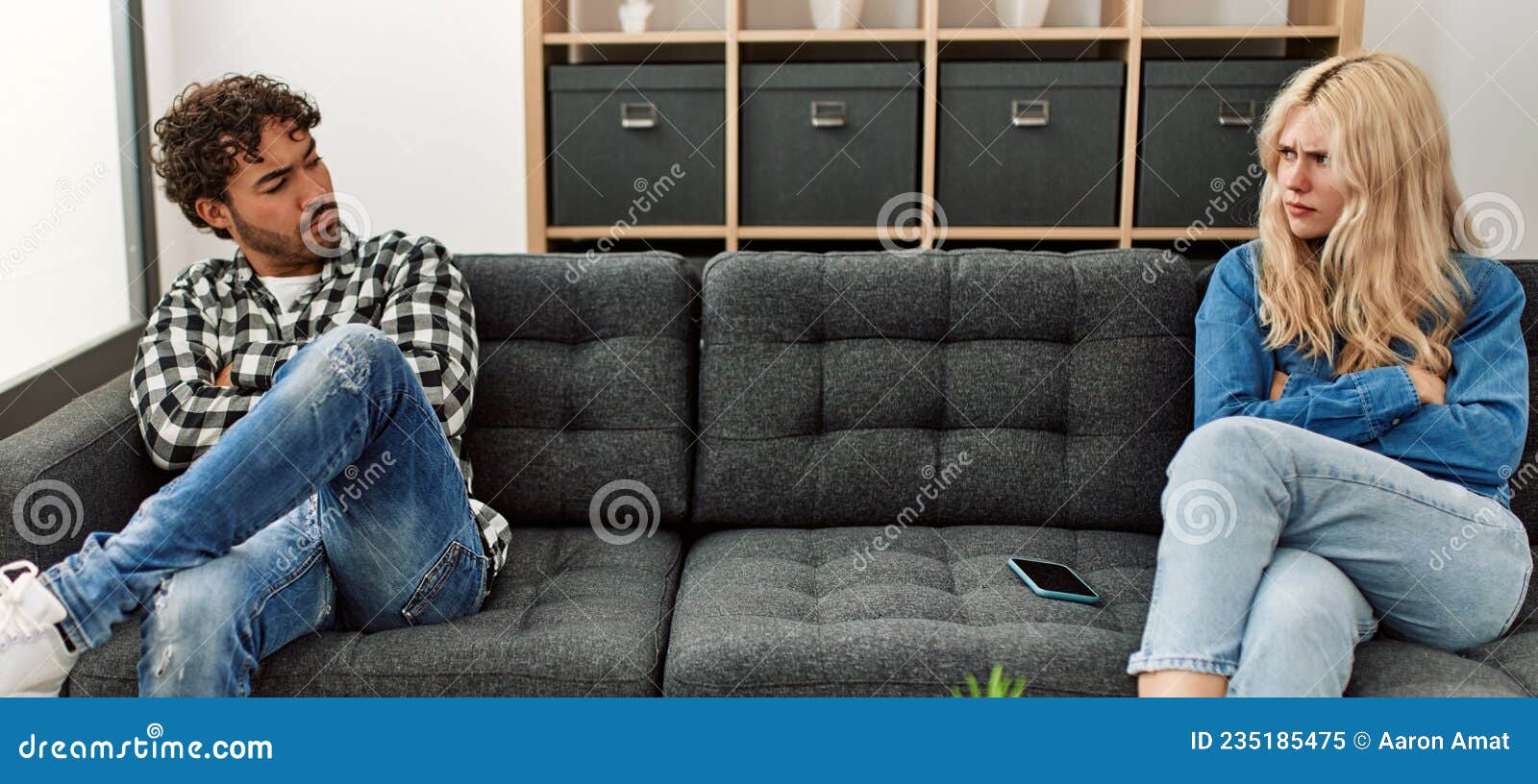 Young Couple Angry Sitting on the Sofa in Silence at Home Stock Image ...
