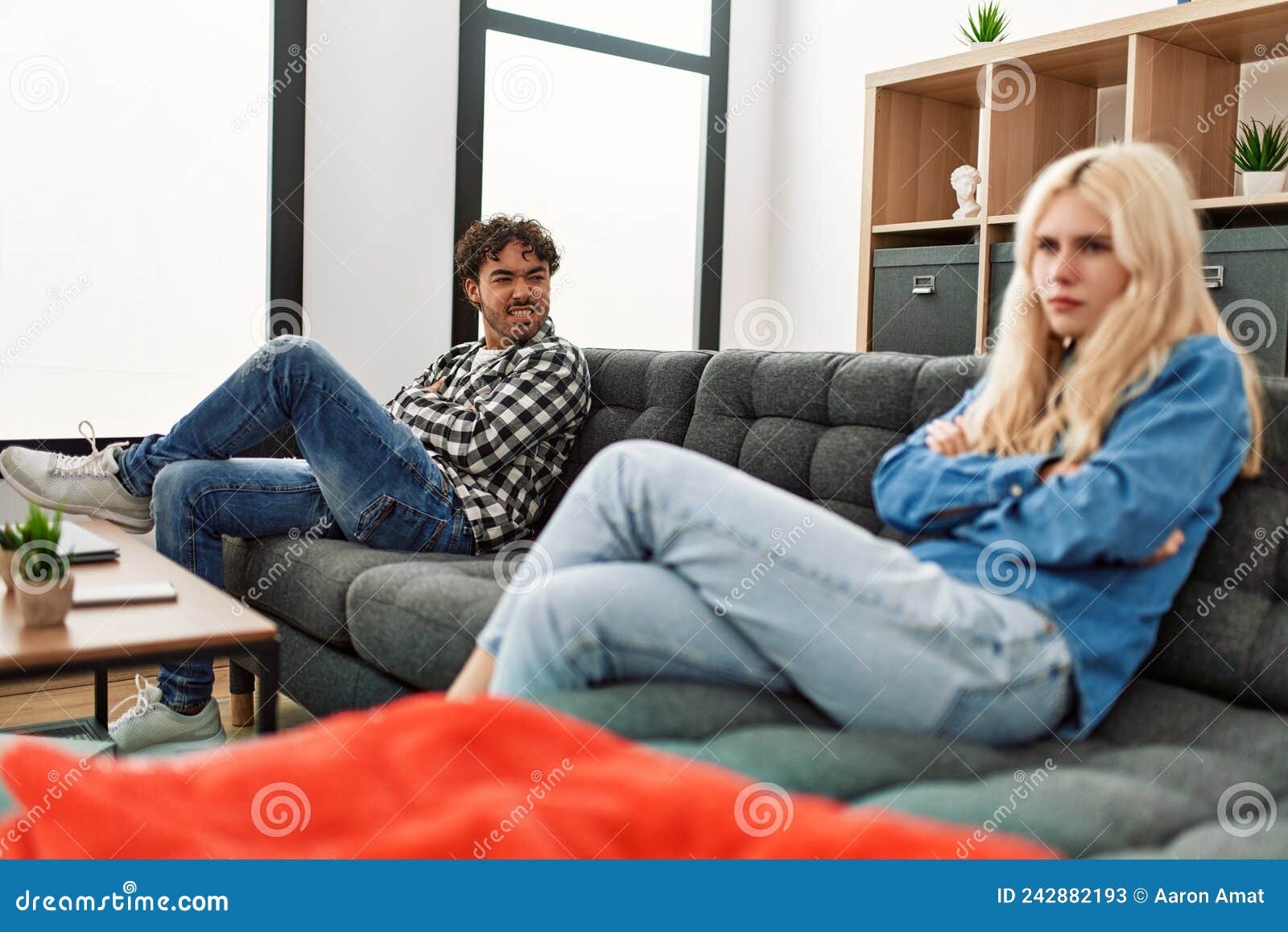Young Couple Angry Sitting on the Sofa in Silence at Home Stock Image ...
