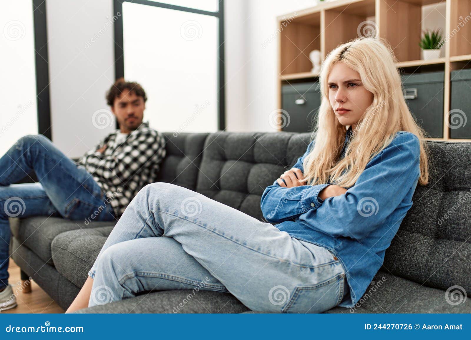 Young Couple Angry Sitting on the Sofa in Silence at Home Stock Photo ...