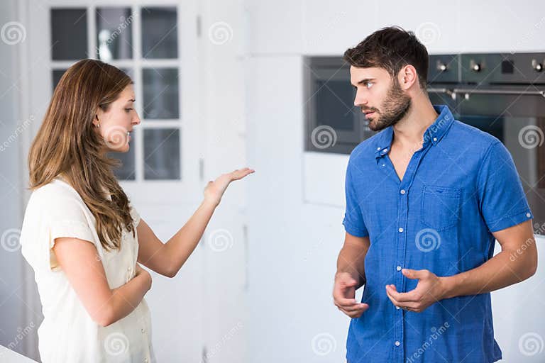 Young Couple Arguing in Kitchen Stock Photo - Image of stern ...