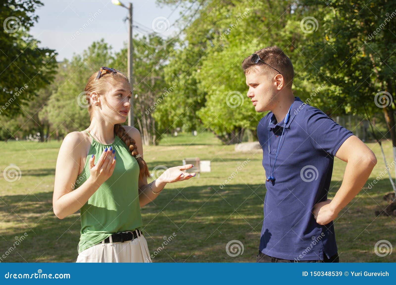 Young Couple Arguing while Sitting on Bench in Park. Problems in ...