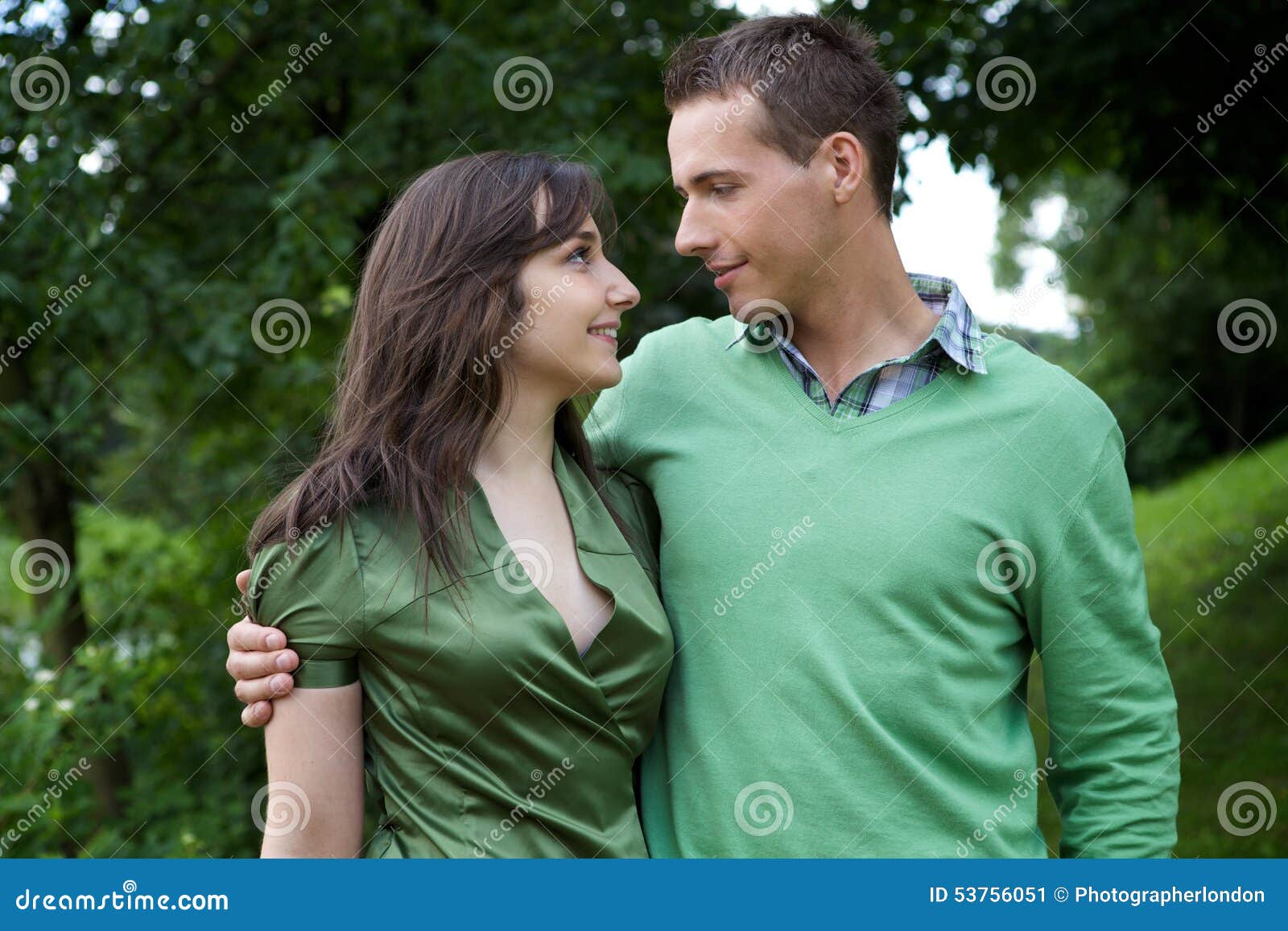 Young Couple with Arm Around and Looking at Each Other Stock Image ...