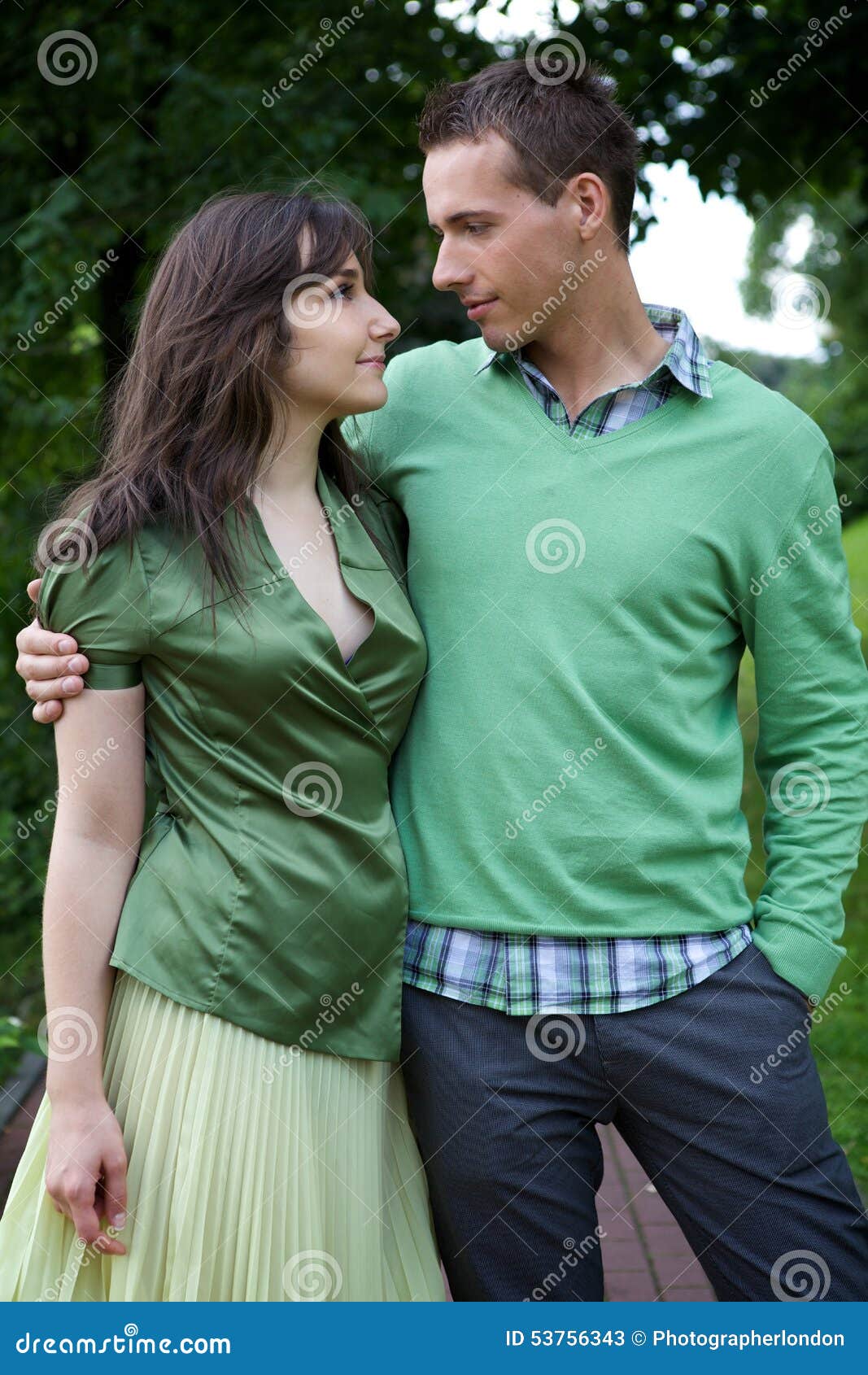 Young Couple with Arm Around and Looking at Each Other Stock Image ...
