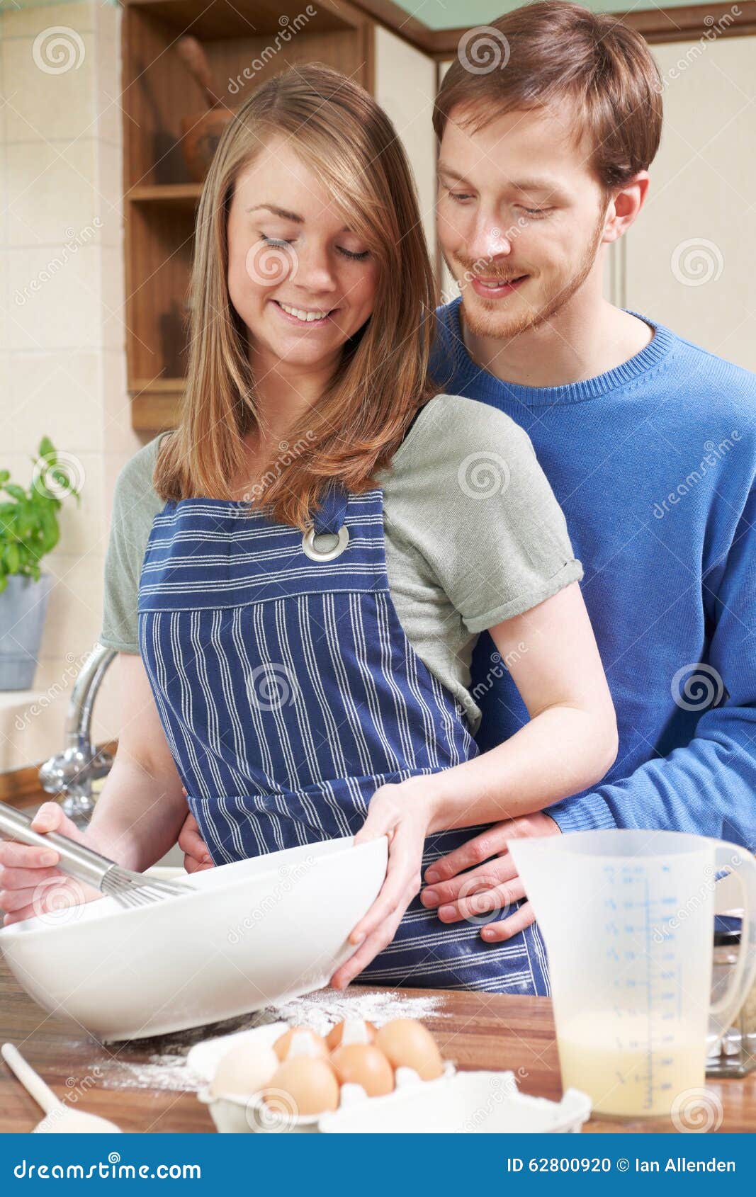 Young Couple Baking in Kitchen Together Stock Photo - Image of bowl ...