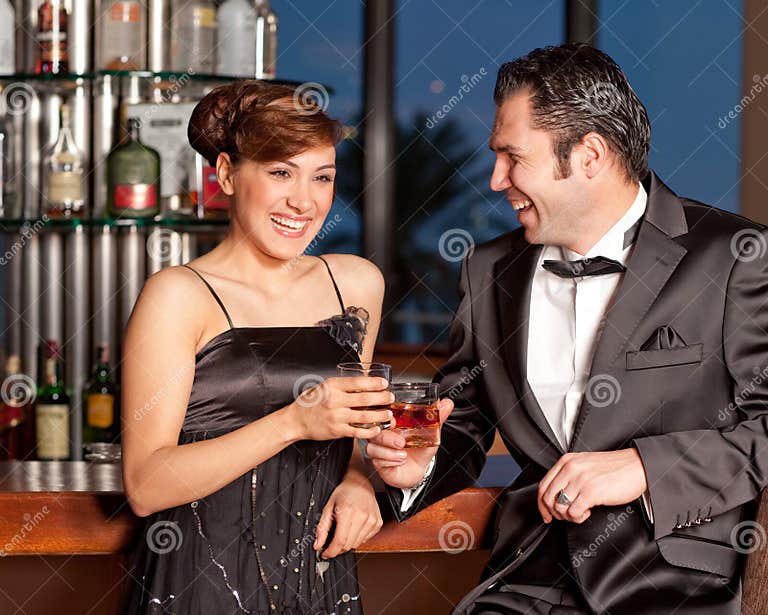 Young Couple at Bar Drinking and Flirting Stock Image - Image of night ...