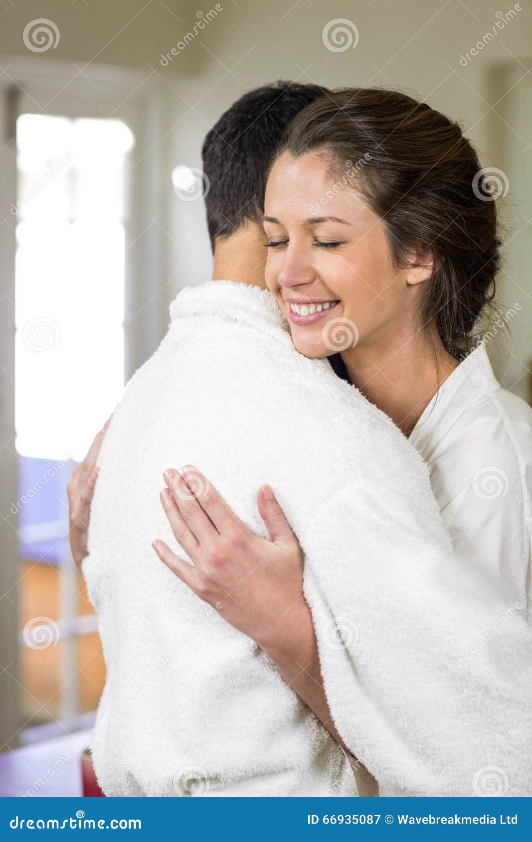Young Couple in Bathrobe Cuddling Each Other Stock Image - Image of ...