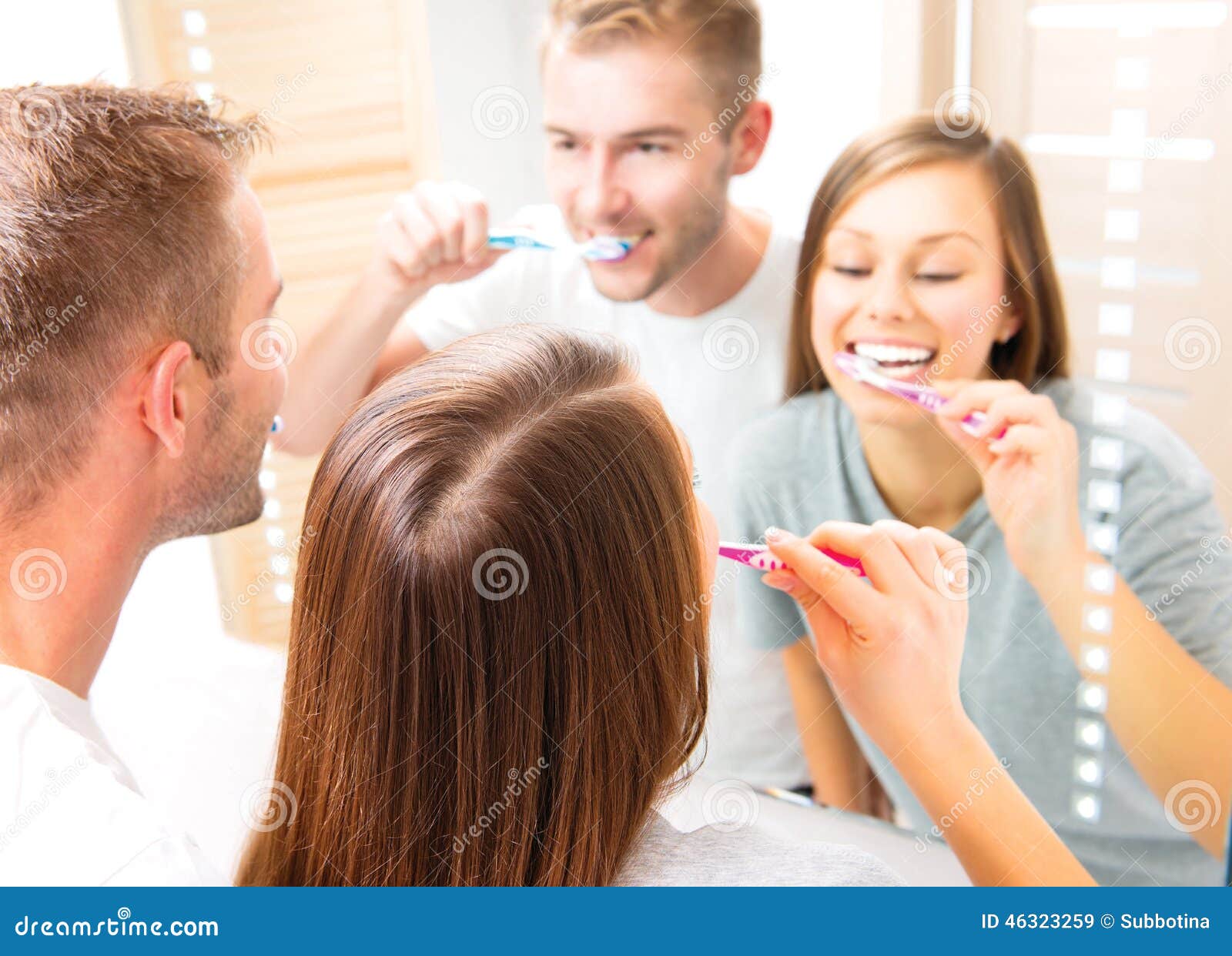 Young Couple in the Bathroom Brushing Teeth Stock Image - Image of ...