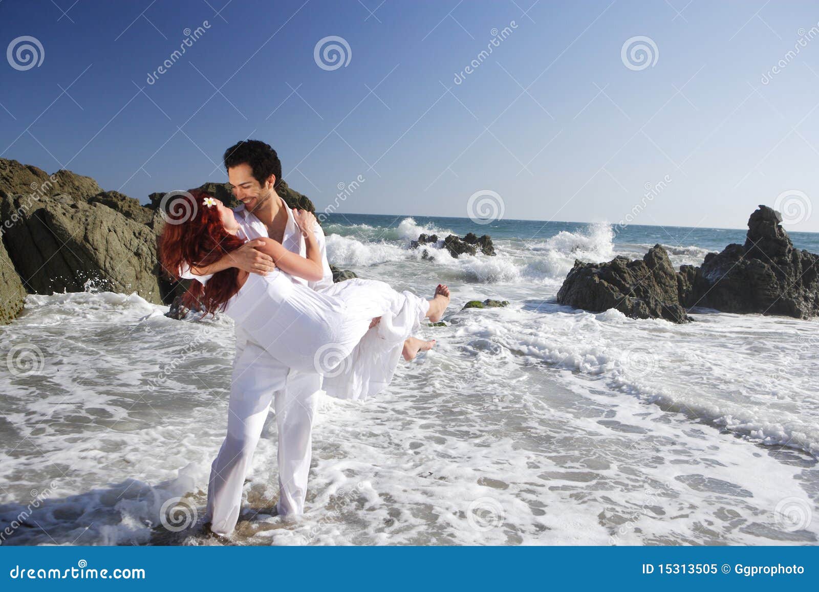 Young Couple at the Beach Playing in Waves Stock Image - Image of young ...