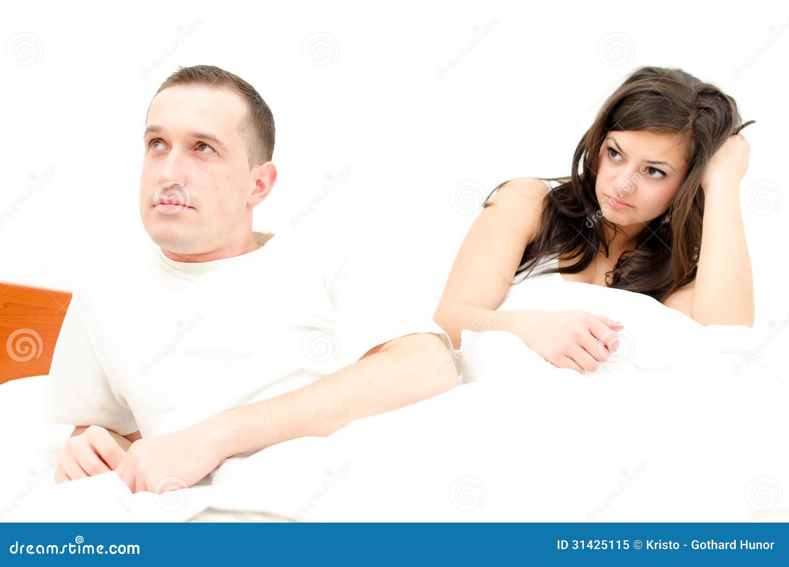 A young couple in bed stock image. Image of couple, tension - 31425115