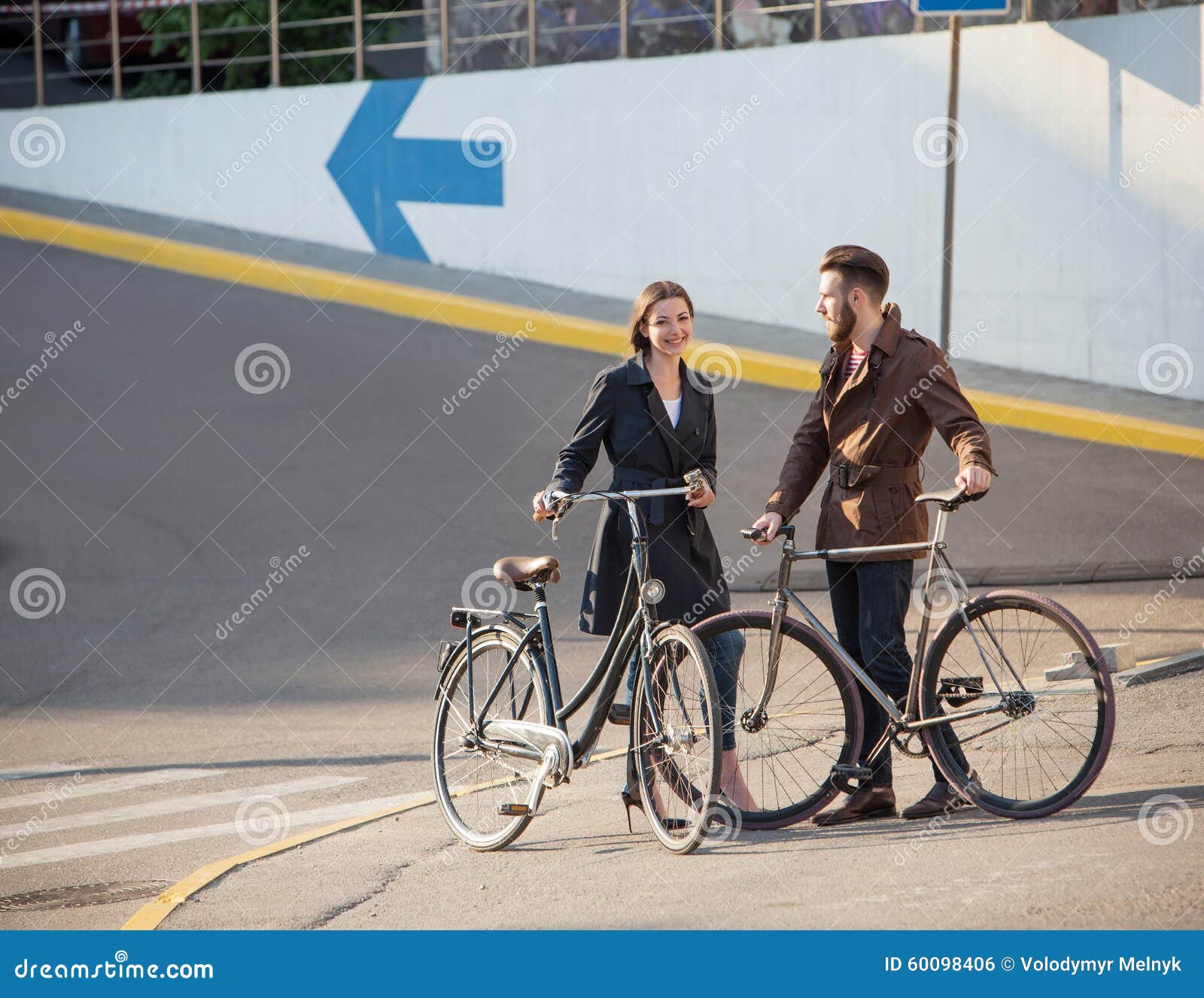 Young Couple with on a Bicycle Opposite City Stock Photo - Image of ...
