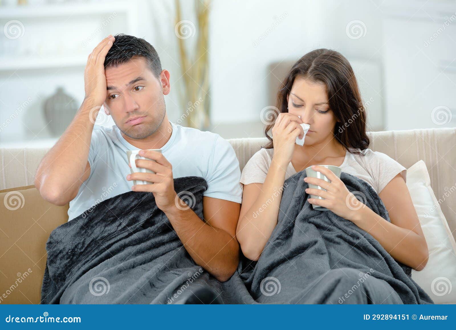 Young Couple Blowing Their Nose in Tissue at Home Stock Image - Image ...