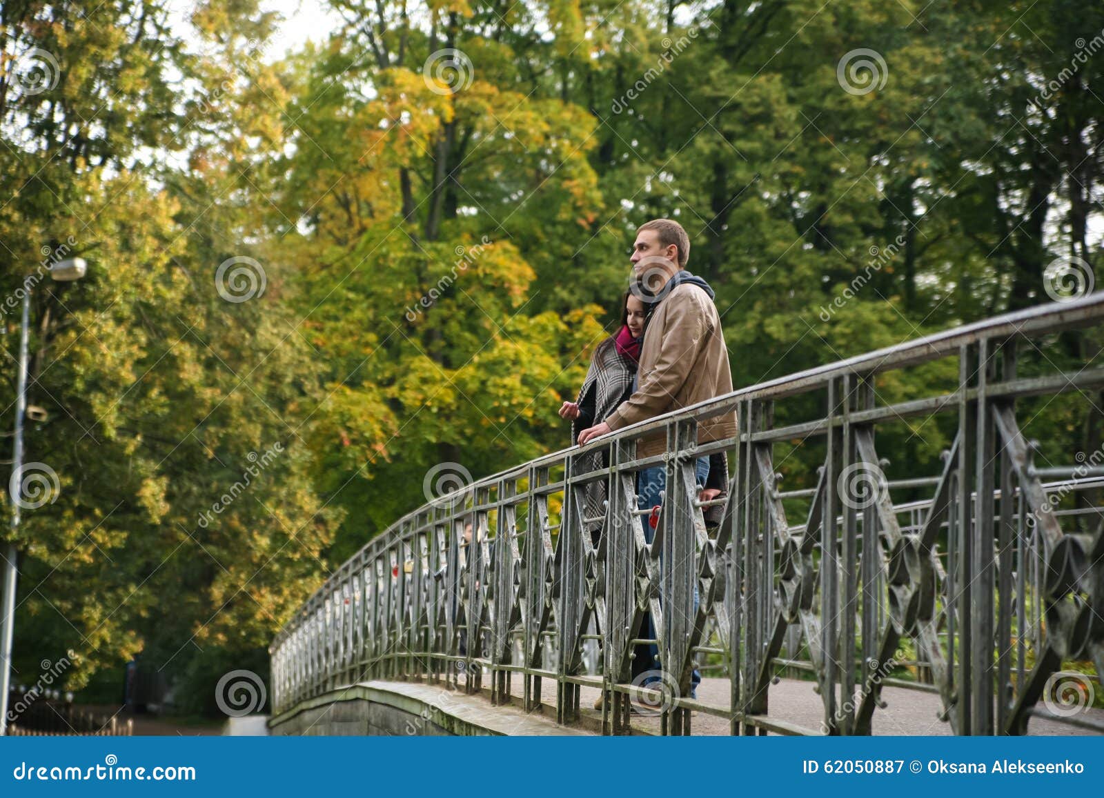 Young Couple on a Bridge in the Fall Stock Image - Image of caucasian ...