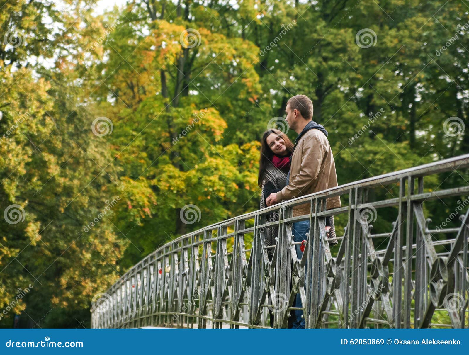 Young couple on a bridge stock image. Image of expressing - 62050869