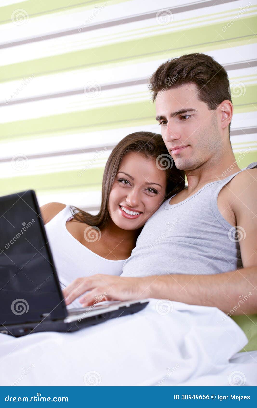 Young Couple Browsing the Internet Stock Photo - Image of happy ...