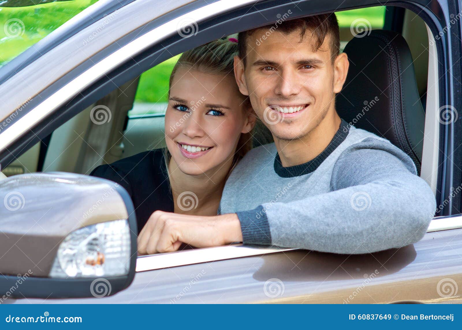 Young couple in car stock image. Image of cute, hand - 60837649