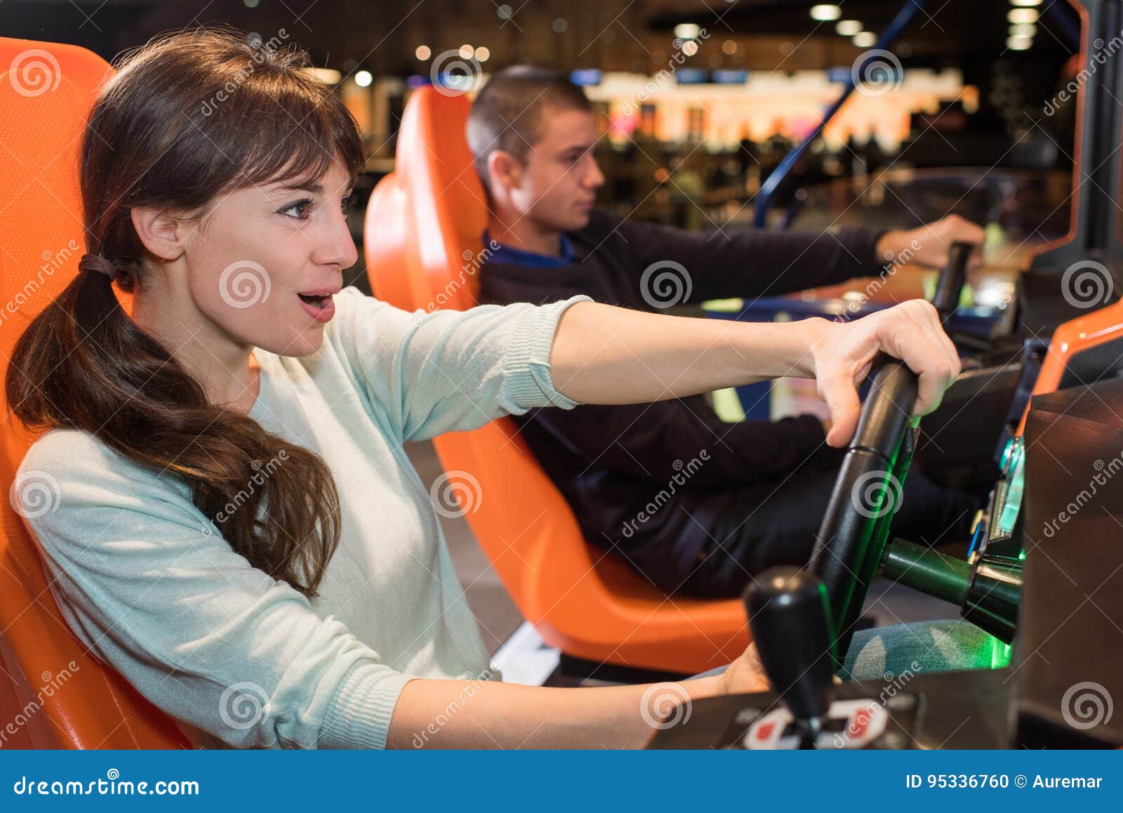Young Couple in Casual Clothes Playing Racing Game Stock Photo - Image ...