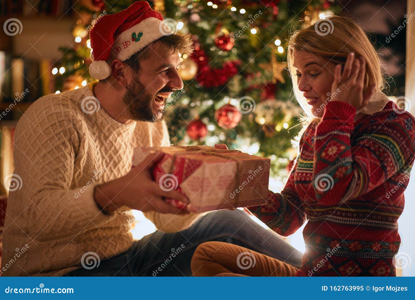 Young Couple Celebrating Christmas and Having Fun Stock Image - Image ...