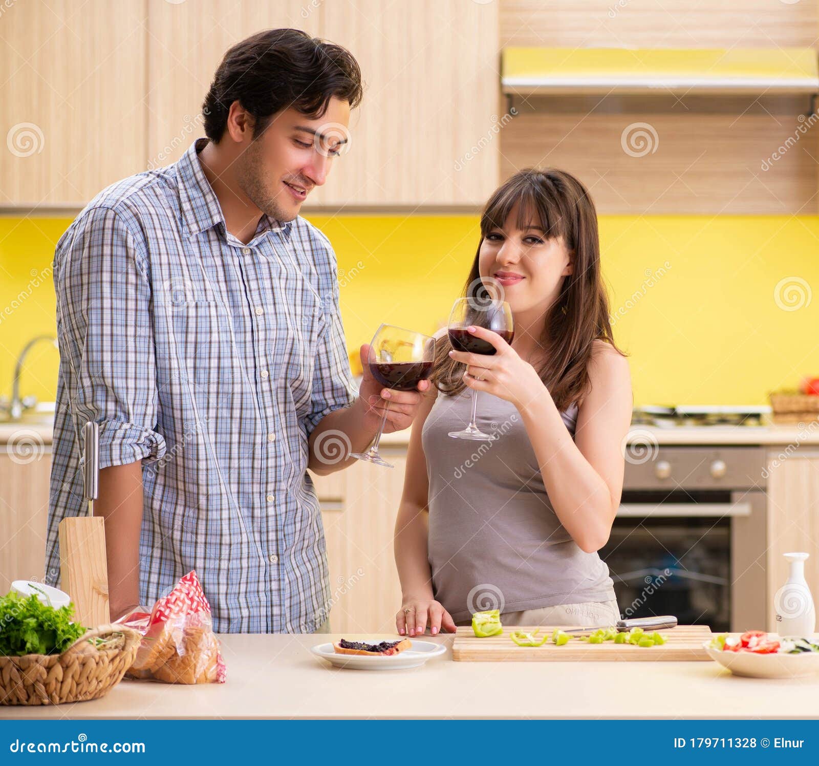 Young Couple Celebrating Wedding Anniversary at Kitchen Stock Photo ...