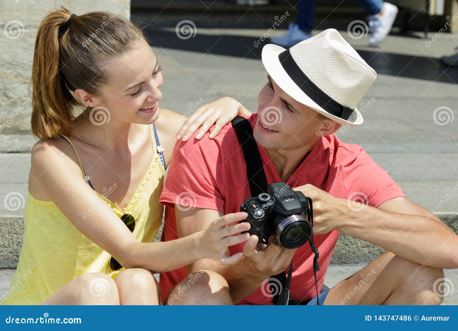 Young Couple Checking Out Photos on Camera Stock Photo - Image of ...