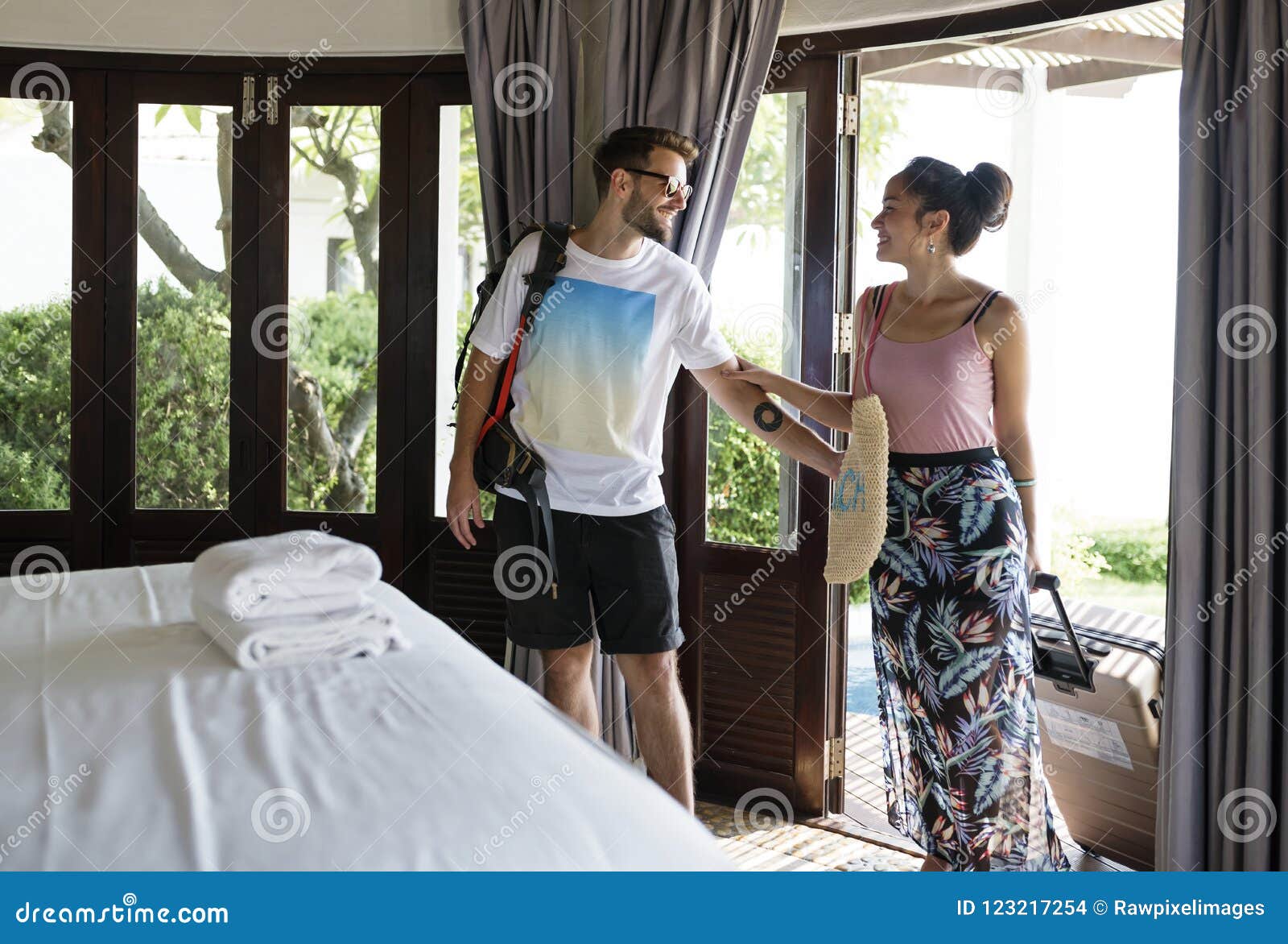 Young Couple Checking in To a Resort Stock Photo - Image of bedroom ...