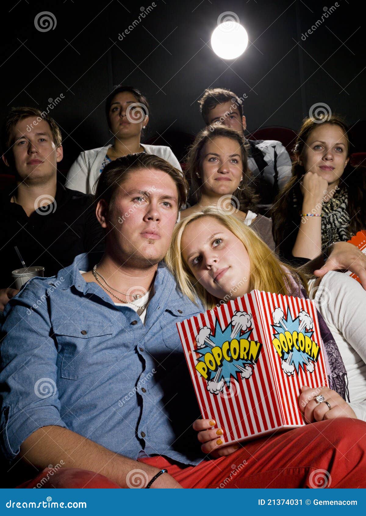Young couple at the cinema stock image. Image of cheering - 21374031