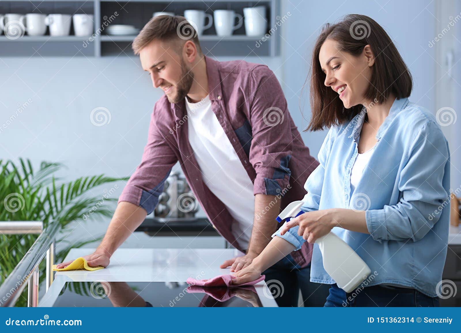 Young Couple Cleaning Kitchen Together Stock Photo - Image of chores ...