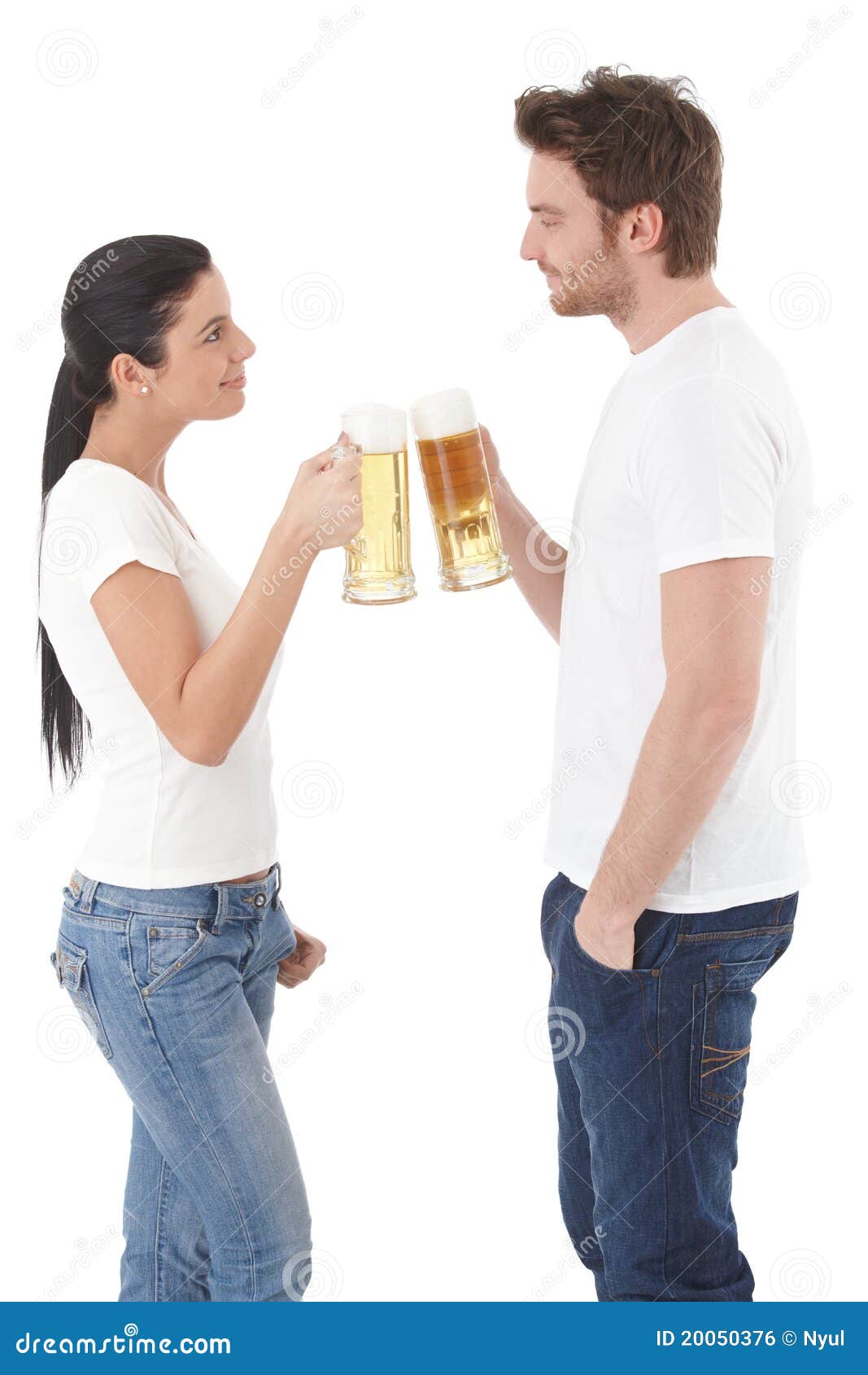 Young Couple Clinking with Mugs of Beer Smiling Stock Photo - Image of ...