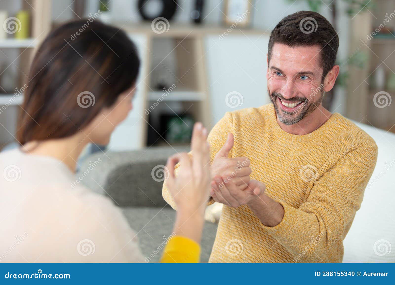 Young Couple Communicating with Sign Language at Home Stock Image ...