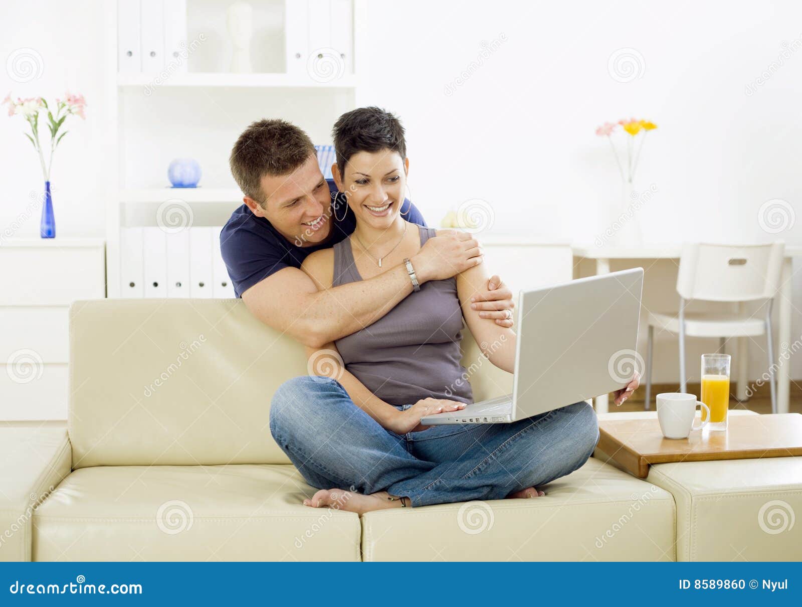 Young couple with computer stock photo. Image of females - 8589860