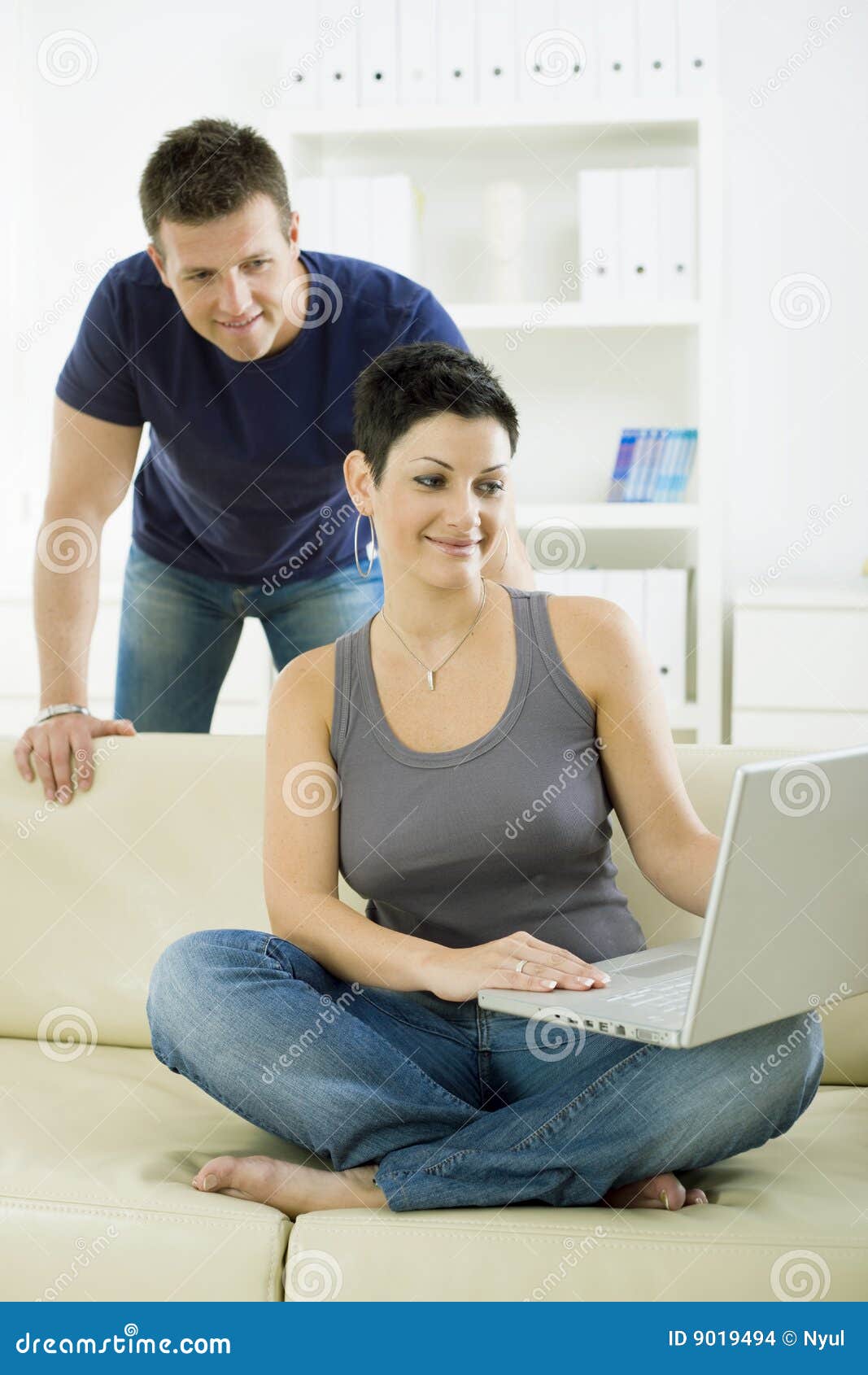 Young couple with computer stock photo. Image of adult - 9019494