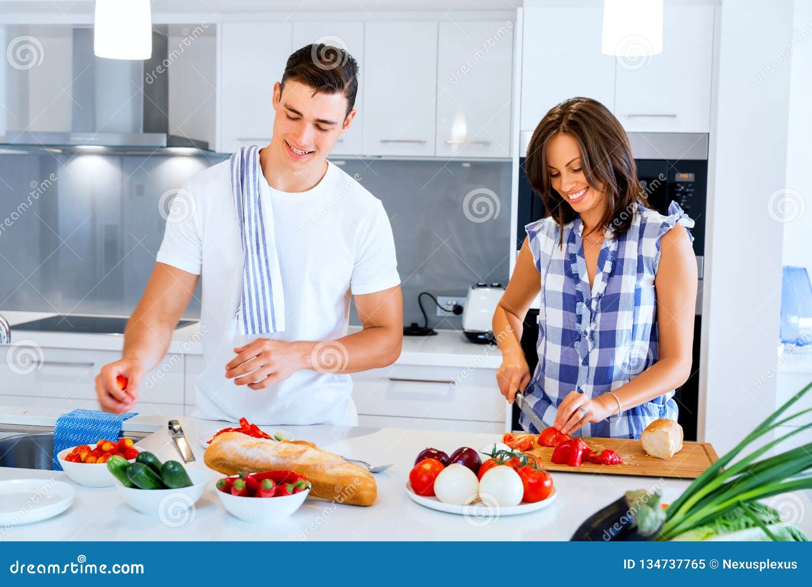 Young Couple Cooking at Home Stock Image - Image of boyfriend, husband ...