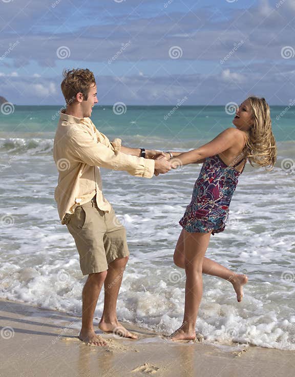 A Young Couple Dance on the Beach Stock Photo - Image of people, hawaii ...