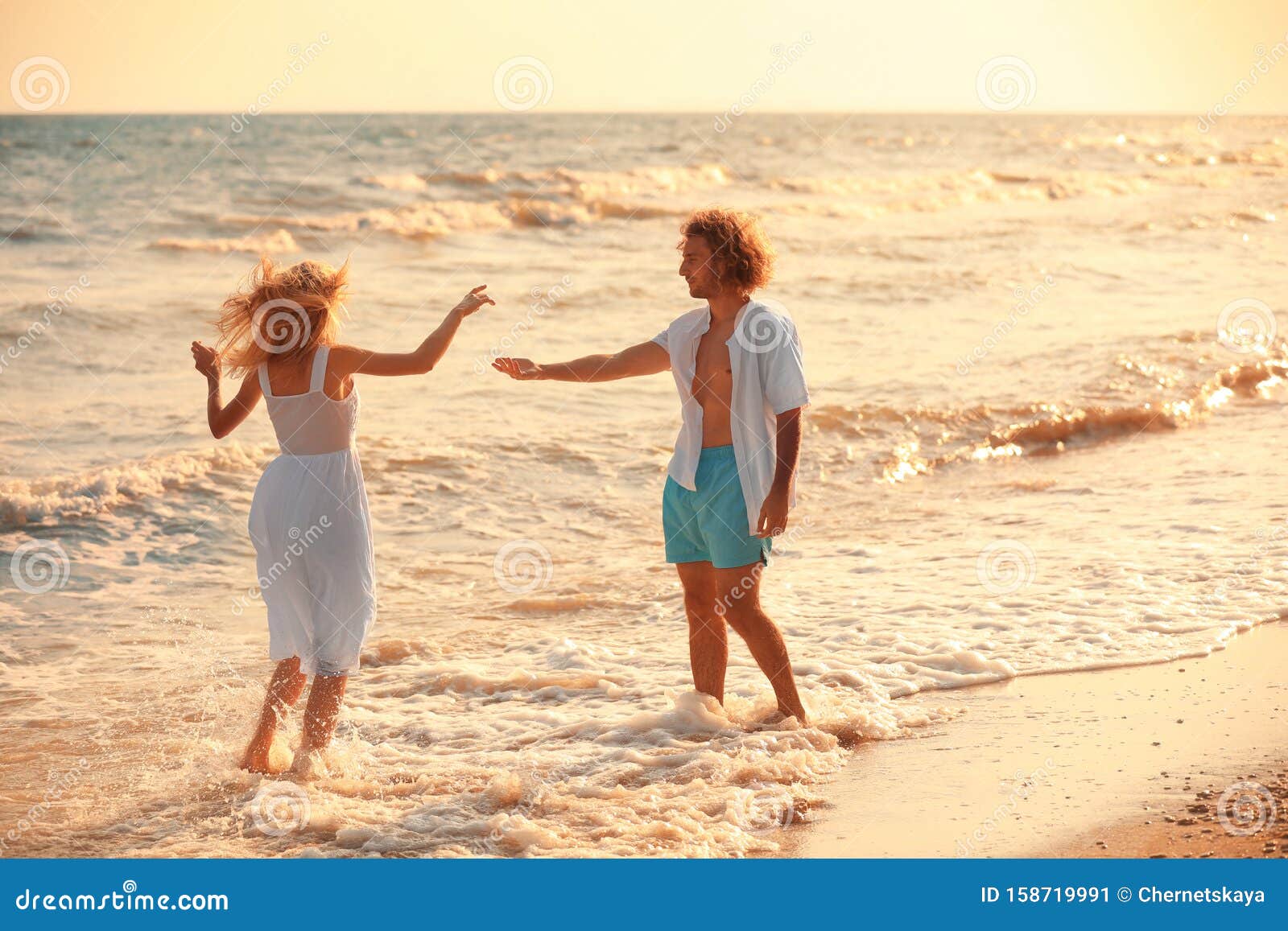Young Couple Dancing on Beach Stock Image - Image of dancing, adult ...